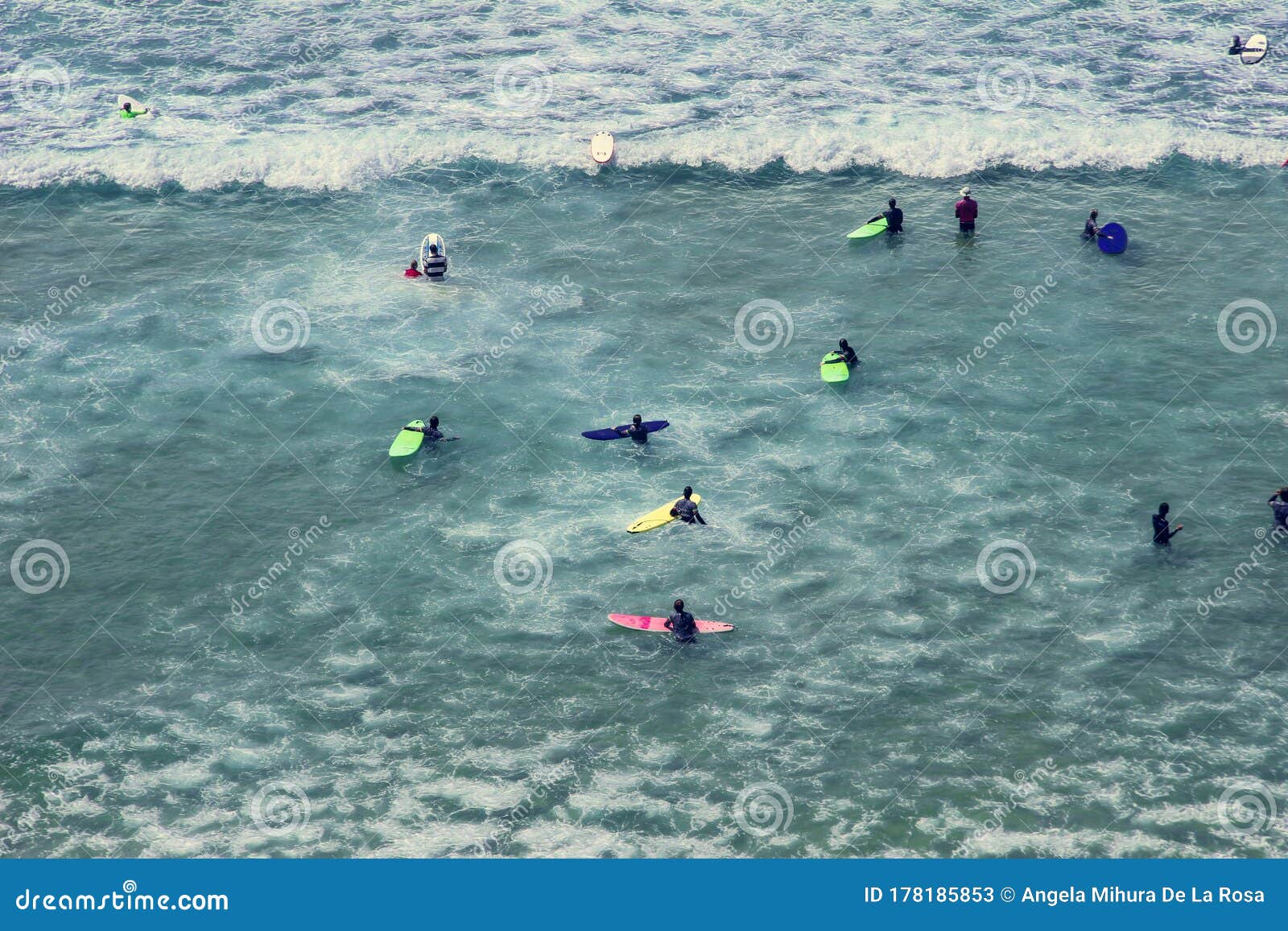A Group of Surfers Waiting for a Good Wave Stock Image - Image of ...