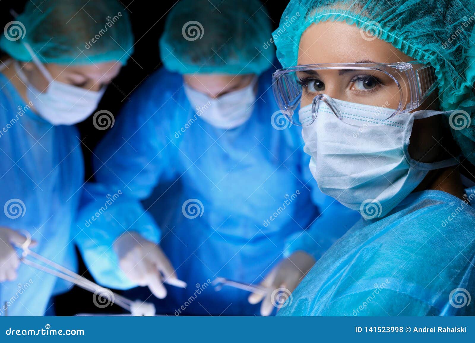 Group of Surgeons in Masks Performing Operation. Medicine, Surgery and ...