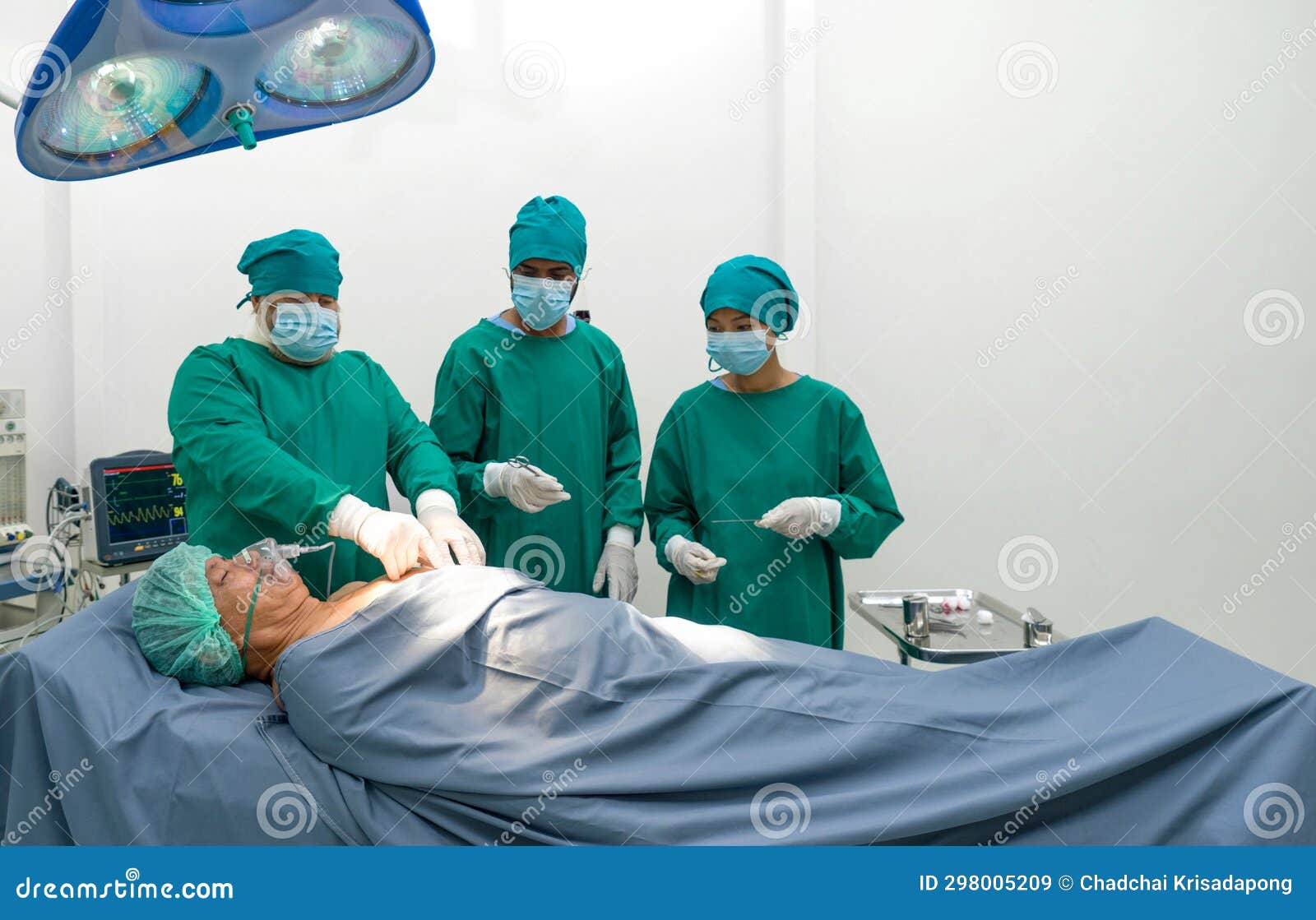Group of Surgeons, Steeped in Concentration, Performing Complex Surgery ...