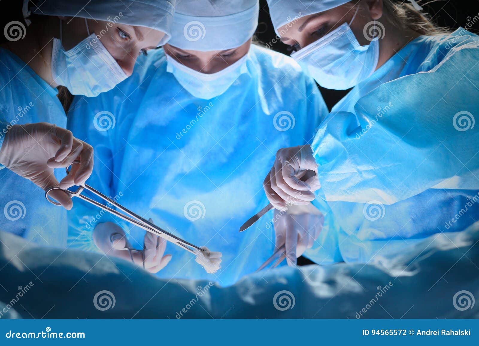 Group of Surgeons at Work in Operating Theater Toned in Blue Stock ...