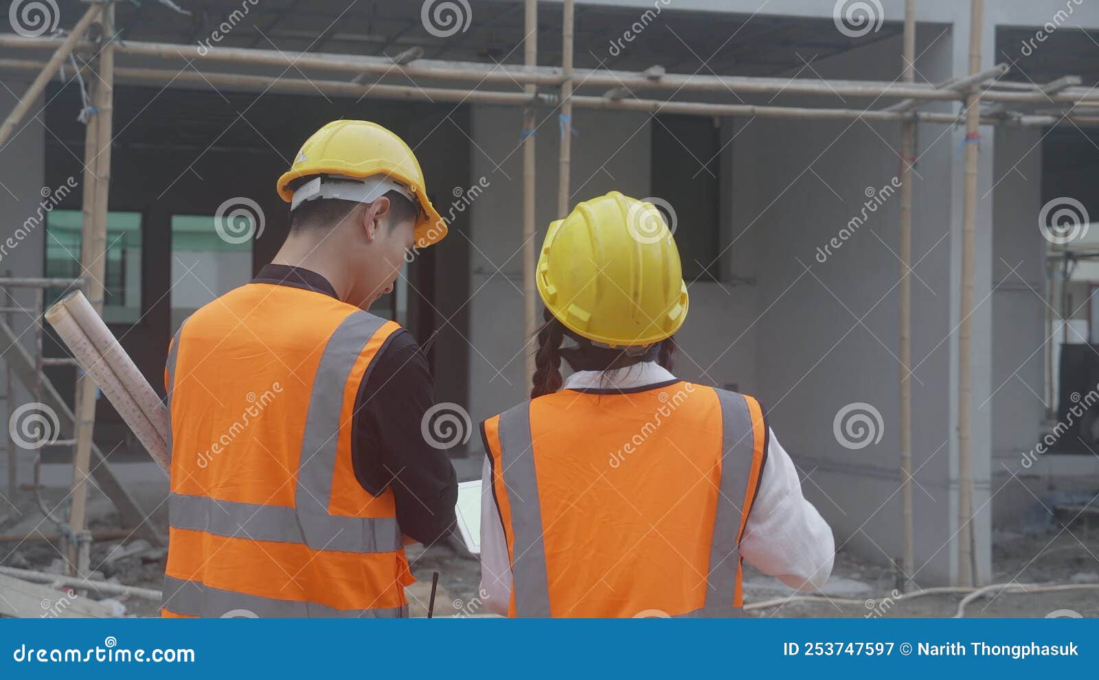 Group Team of Engineer and Architect Holding Blueprint and Explaining ...