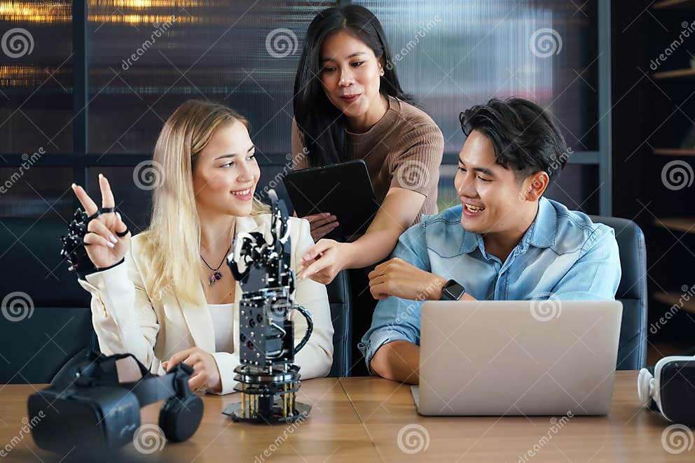 Group Team Work Programer and Engineer Working AI Robot Arm System ...
