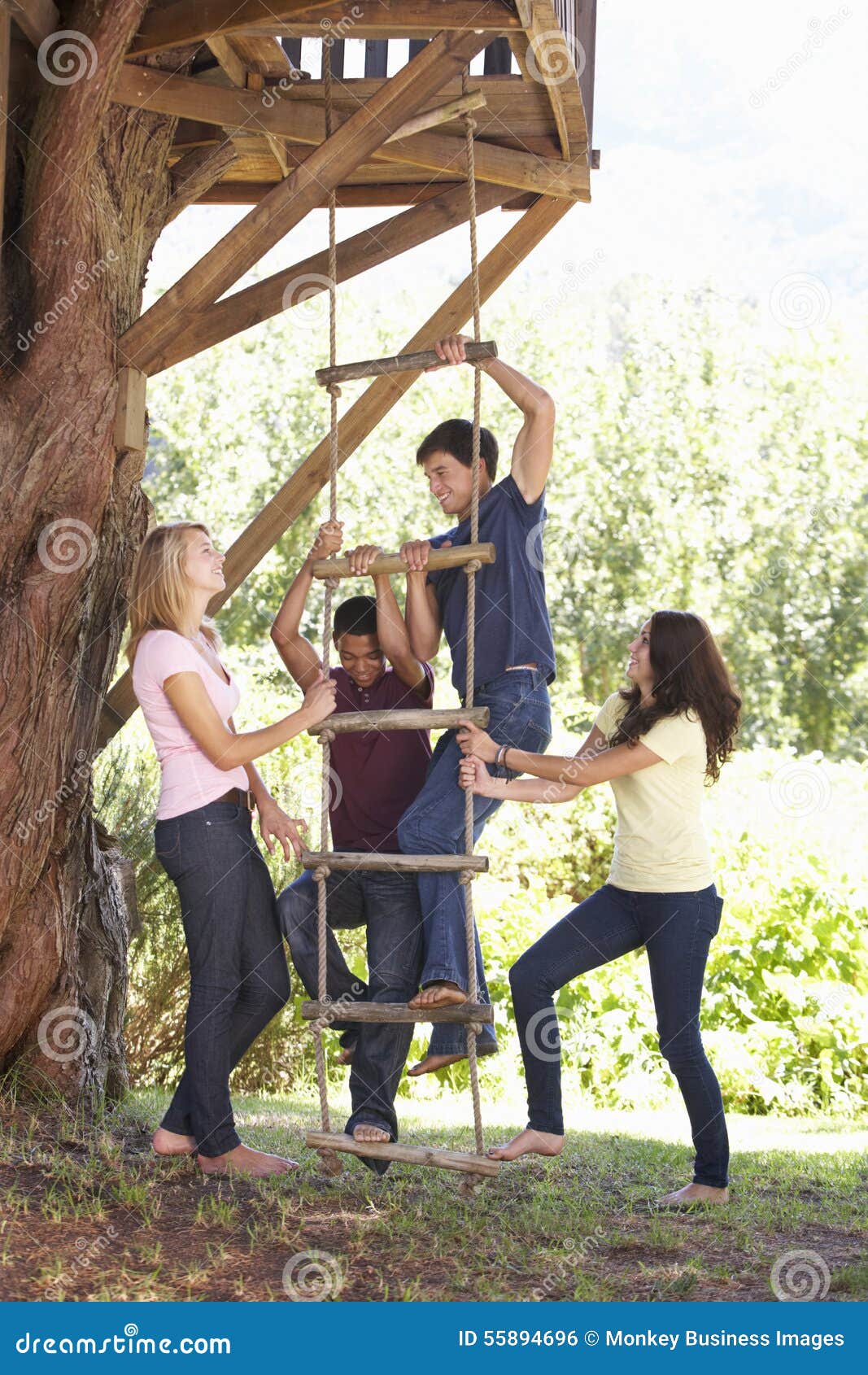 Group of Teenage Friends by Treehouse Stock Photo - Image of climbing ...