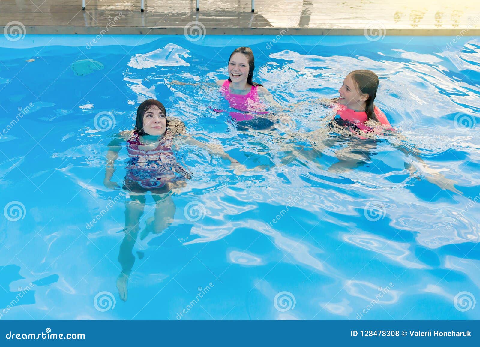 Group of 3 Teenage Girlfriends Having Fun in Swimming Pool Stock Photo ...