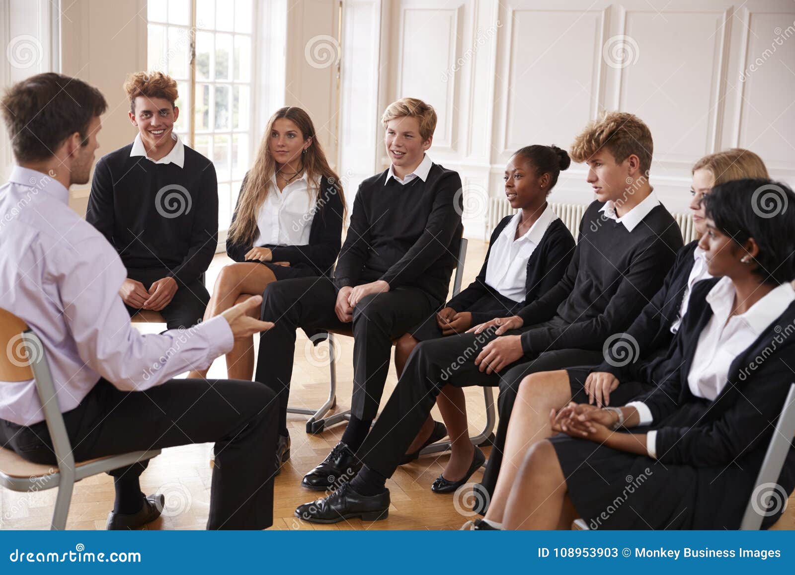 Group of Teenage Students Having Discussion with Tutor Stock Image ...