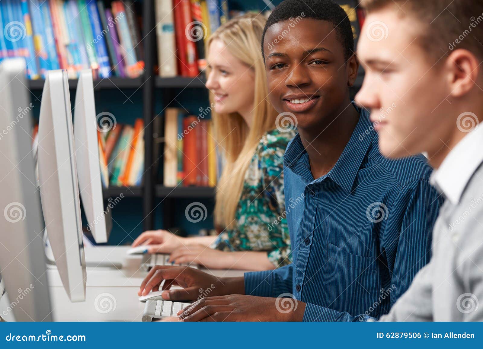 Group of Teenage Students Working at Computers in Classroom Stock Photo ...