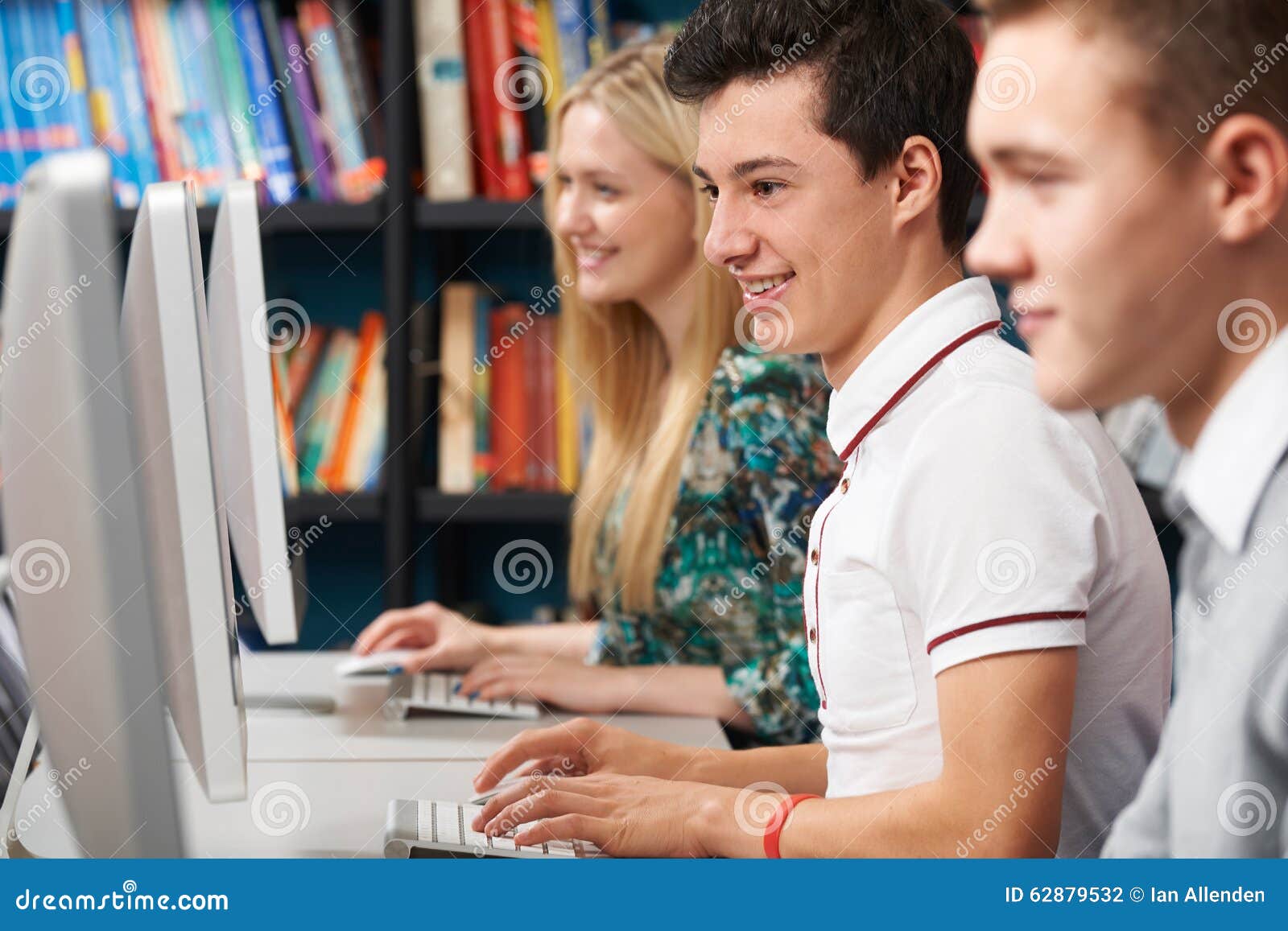Group of Teenage Students Working at Computers in Classroom Stock Photo ...