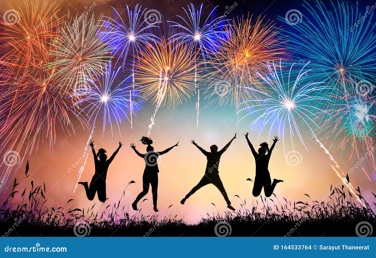 A Group of Teens Jumping with Fun and Watching the Fireworks Stock ...