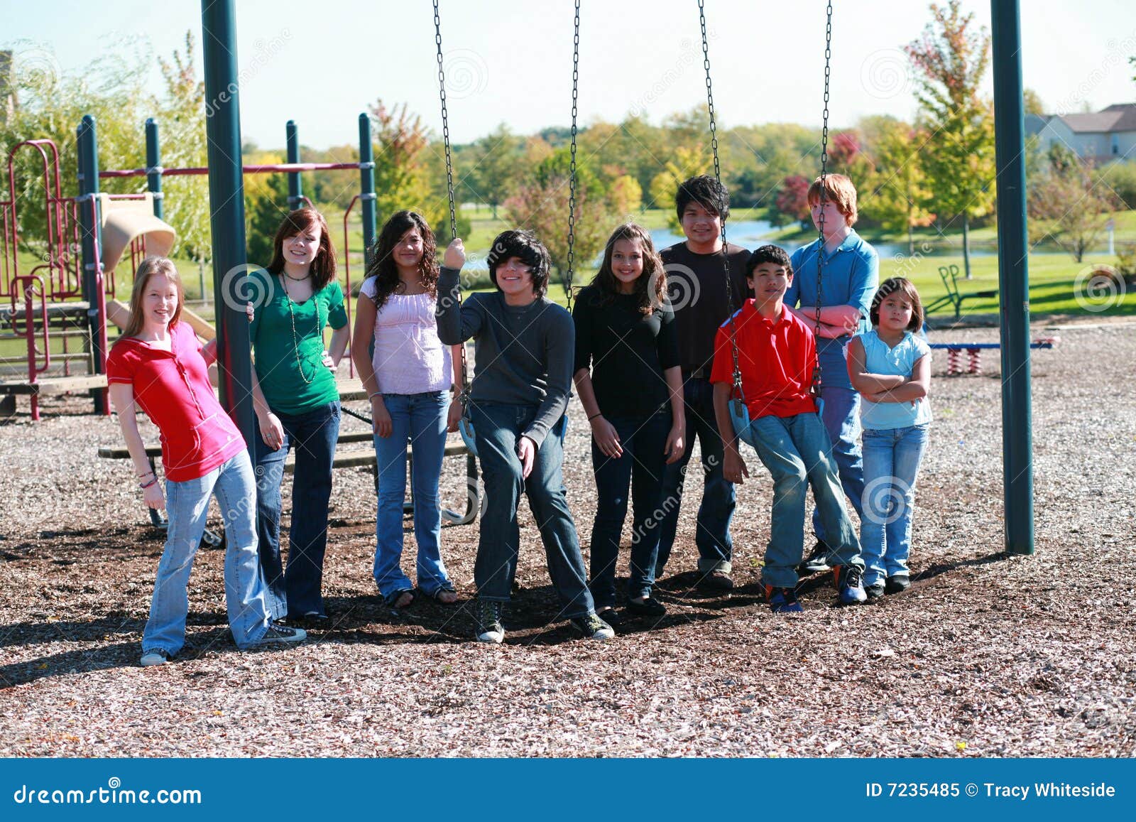 Group of teens on swingset stock image. Image of beautiful - 7235485