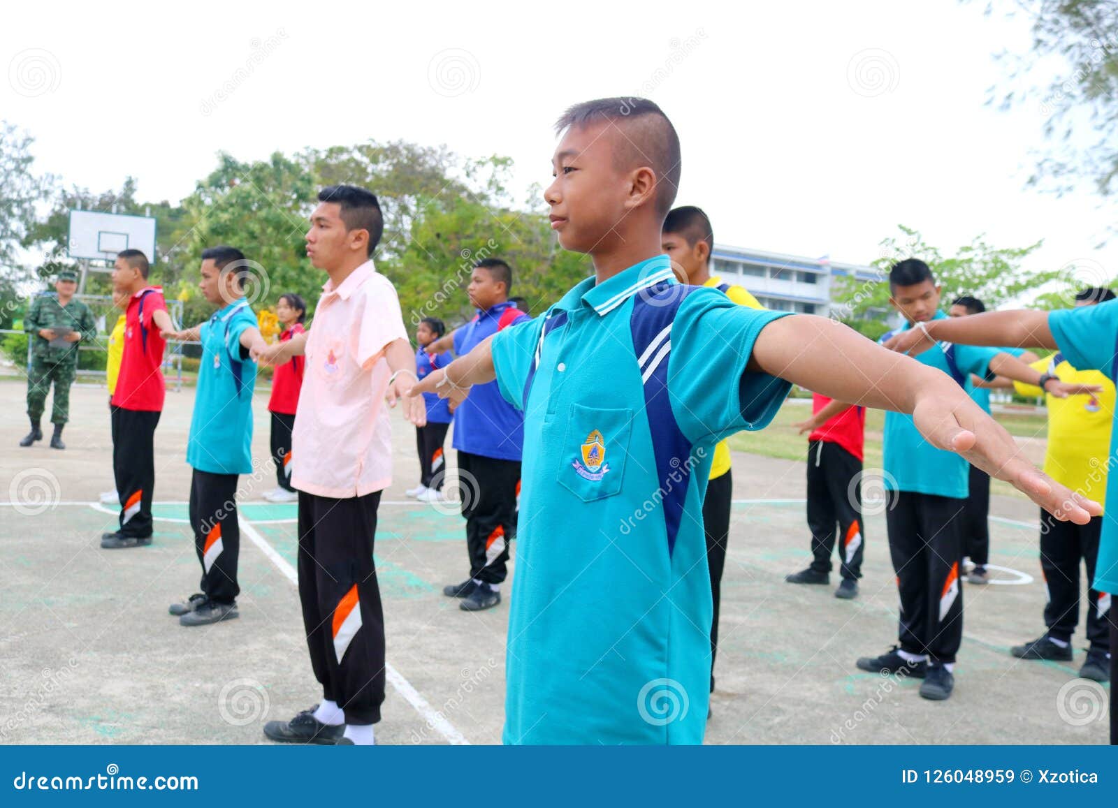 Group of Thai Student are Doing Exercise Together in the Basketball ...