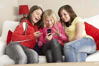 Group of Three Girls Reading Text Message Stock Image - Image of ...