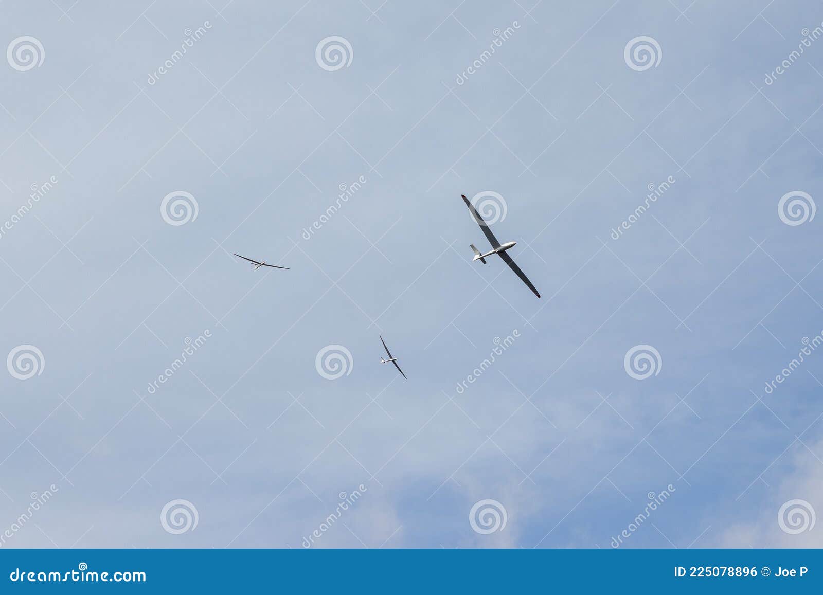 Group of Three Gliders Flying Against Cloudy Sky. High Performance ...
