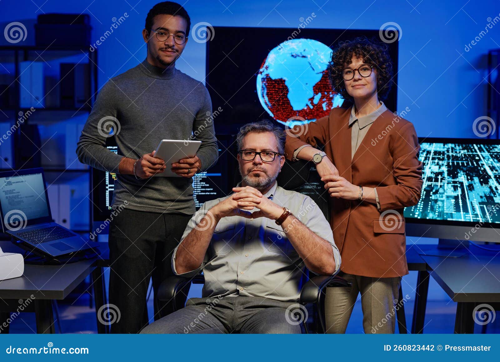 Group of Three Interculltural Programmers Looking at Camera Stock Photo ...