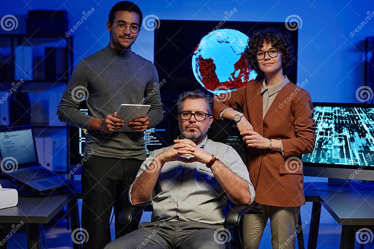 Group of Three Interculltural Programmers Looking at Camera Stock Photo - Image of desktop ...