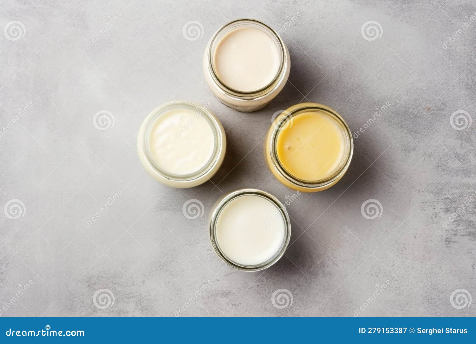 A Group of Three Jars Filled with Different Types of Cream. AI ...