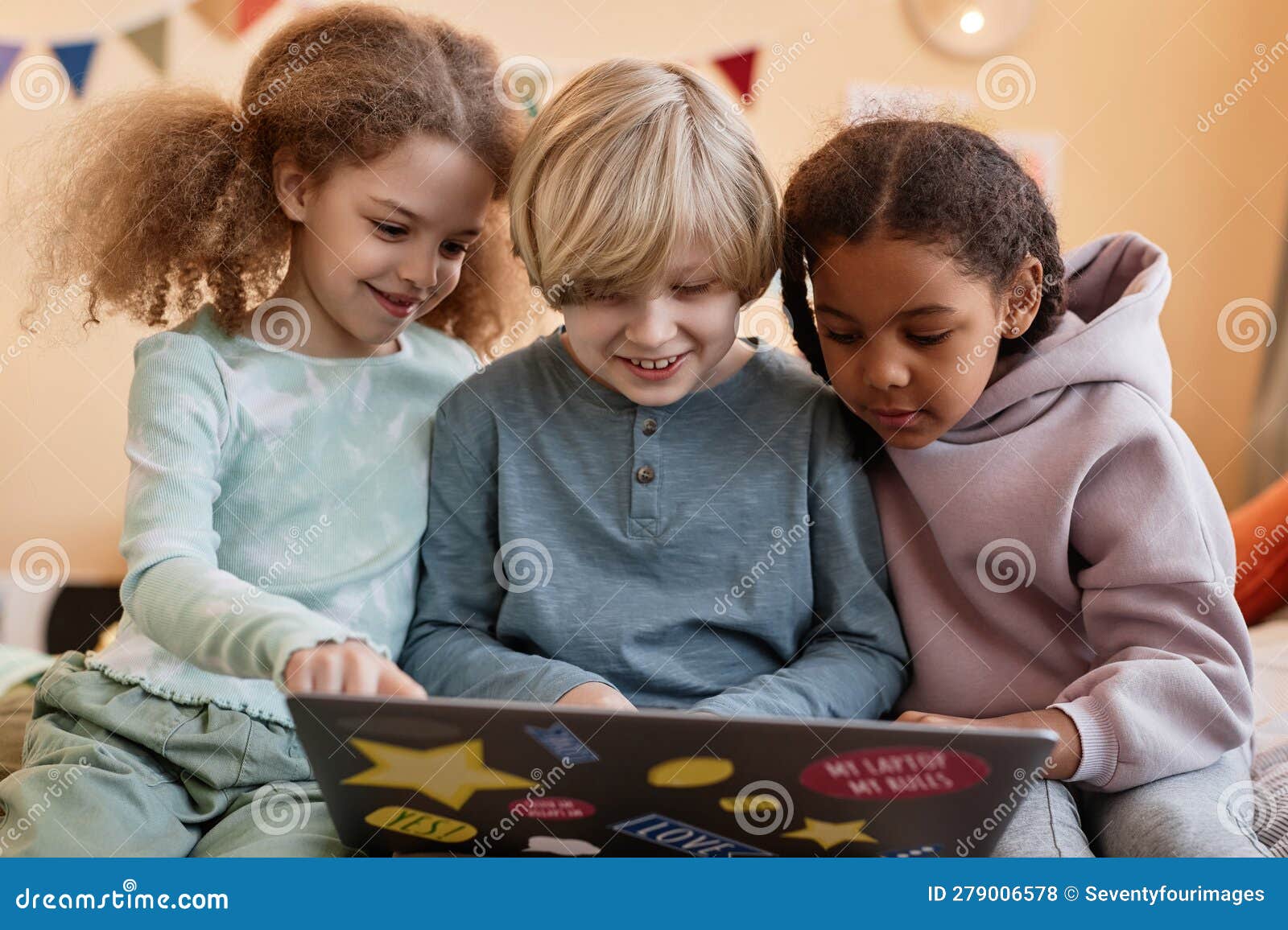 Group of Three Little Children Using Laptop at Home and Smiling Stock ...