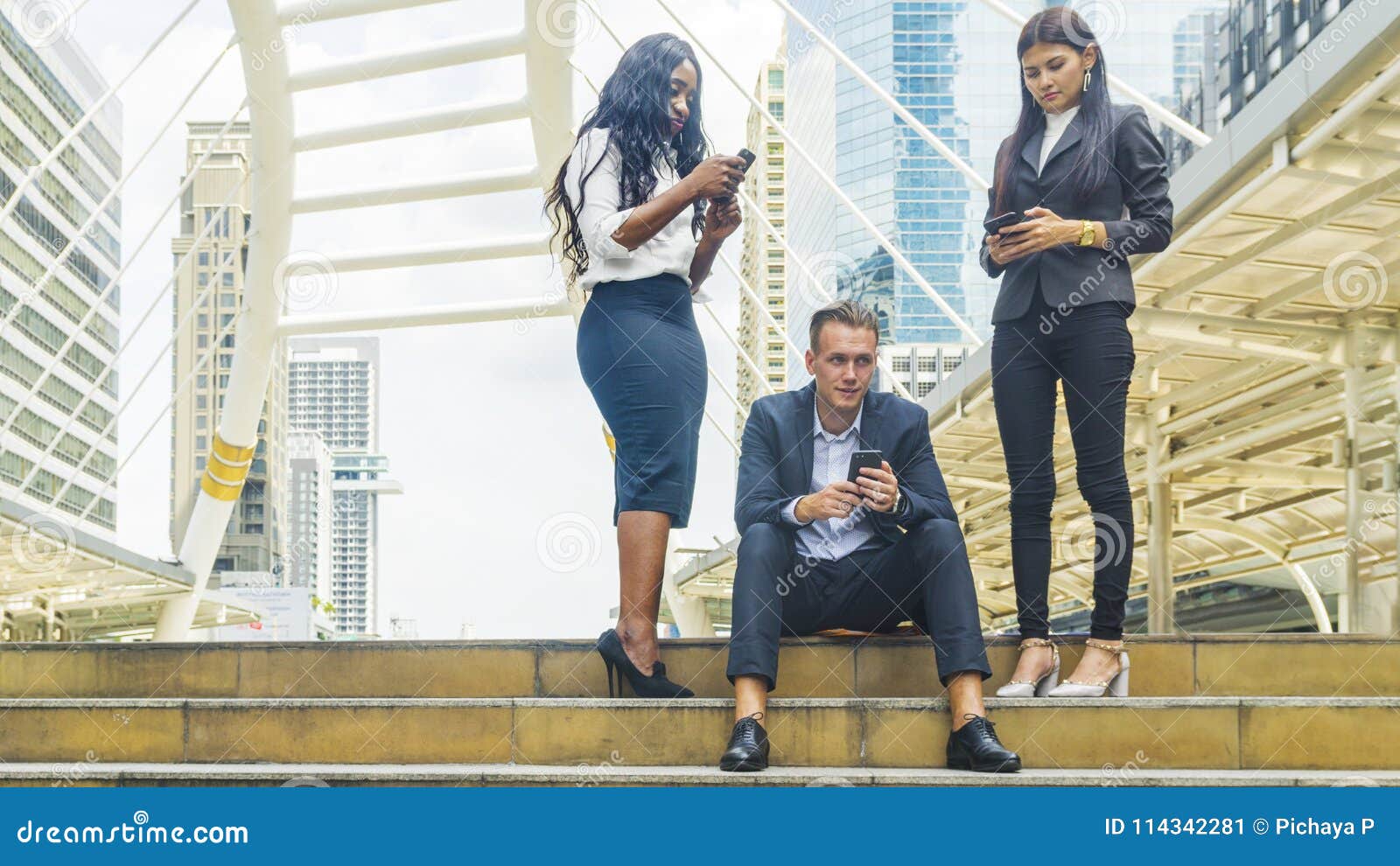 Group of Three People Business Use Mobile Phone and Sit on Stair Stock ...