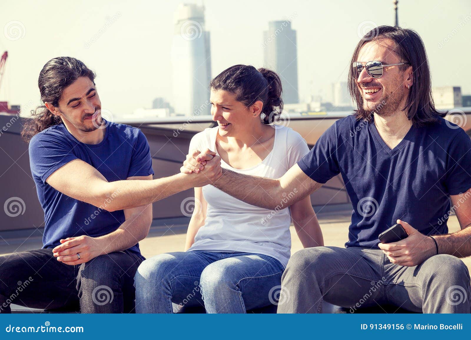 Group of Three Young Friends Shake Hands Stock Photo - Image of friends ...