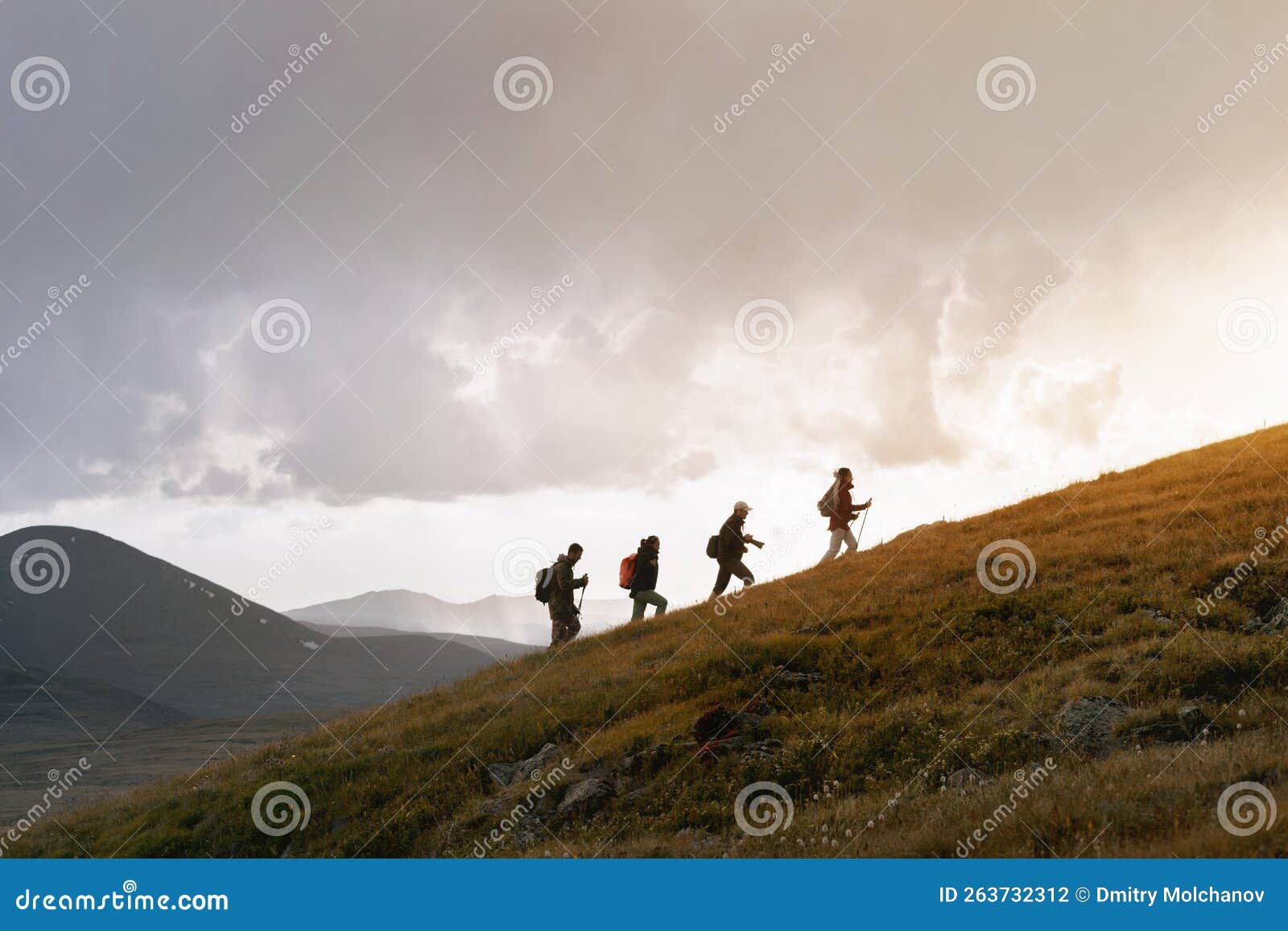 Group of Tourists Hike in Mountains at Sunset Stock Photo - Image of ...