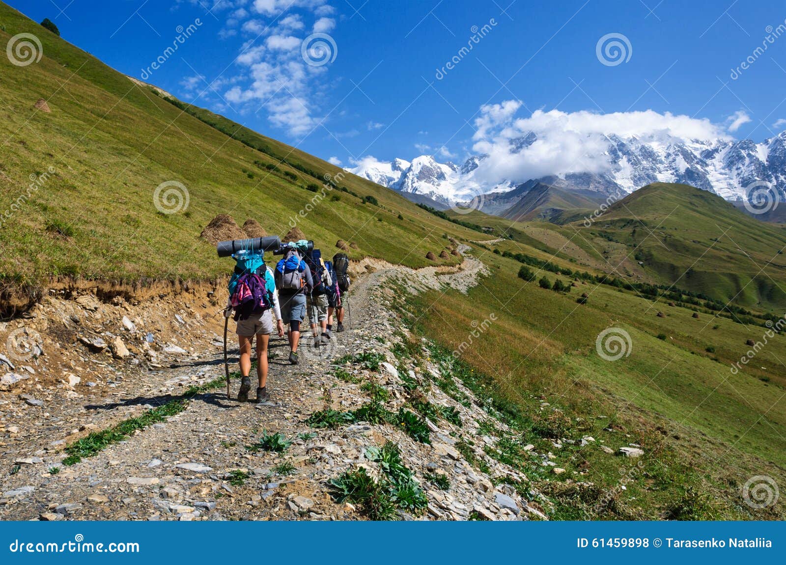 Group of Tourists with Large Backpacks are on Mountain Stock Photo ...