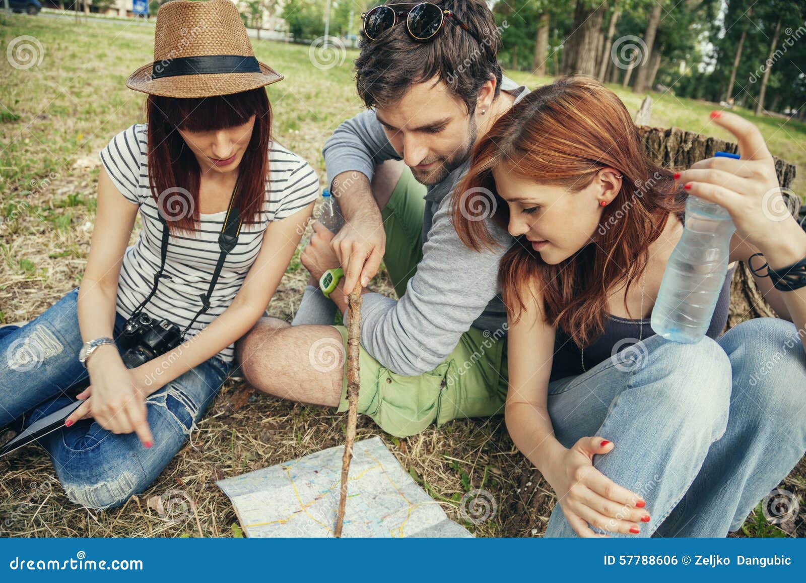 Group of Tourists in Nature Using Map Stock Photo - Image of traveling ...