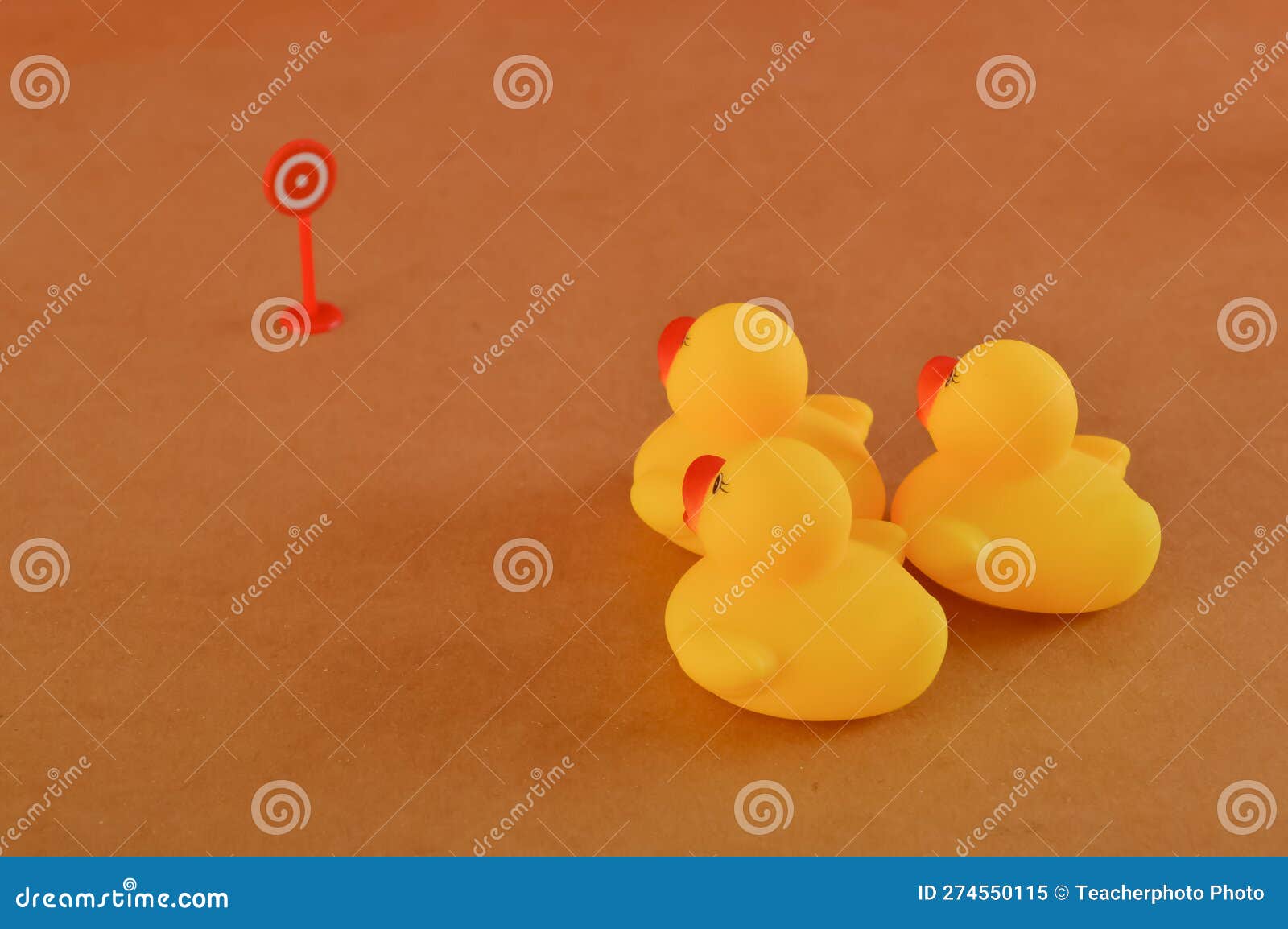 Group of Toy Ducks Heading To the Target. Concept of Achieving Your ...