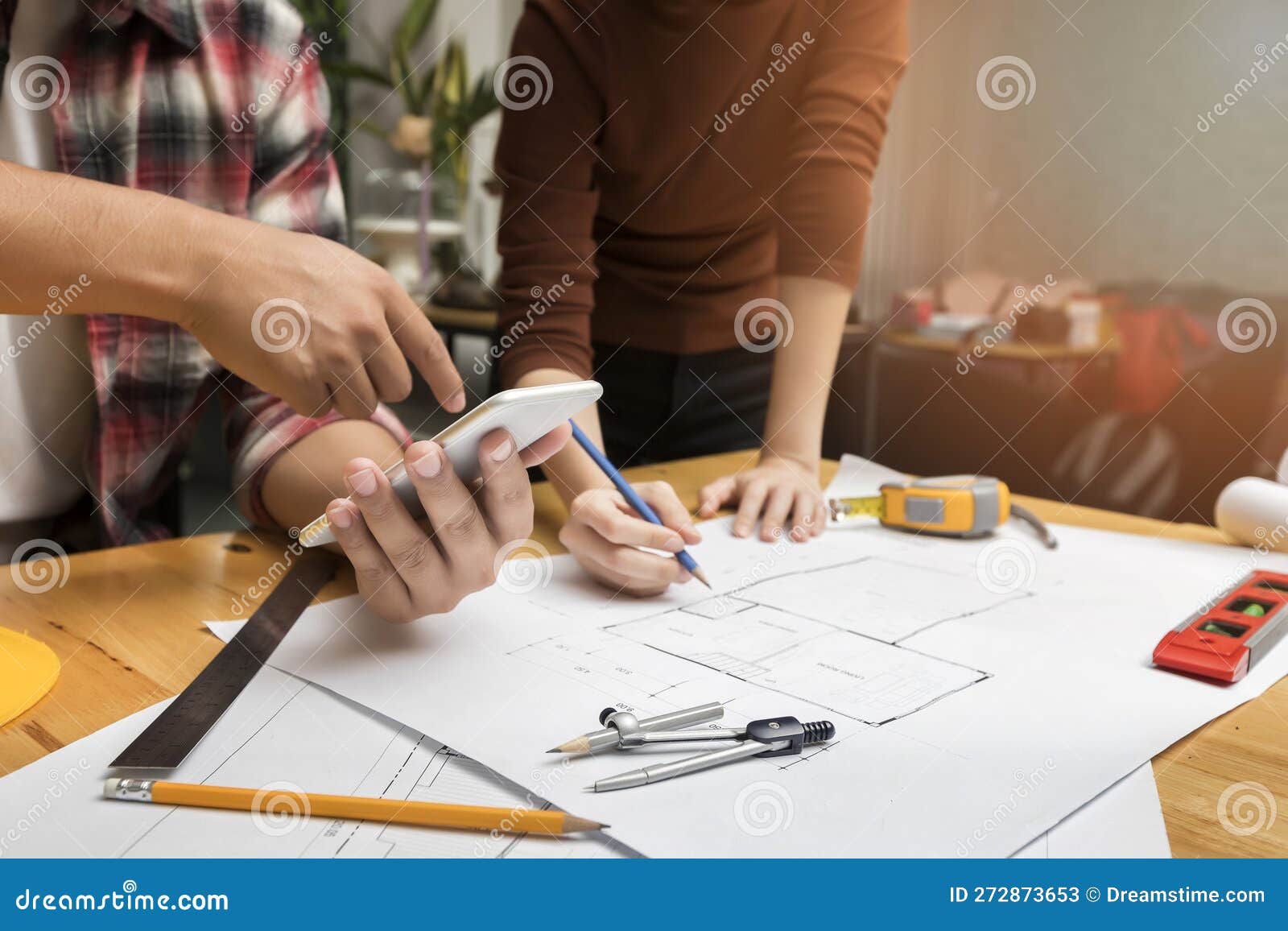 Group of Two Coworkers Working with Blueprint in Office. Co-working ...