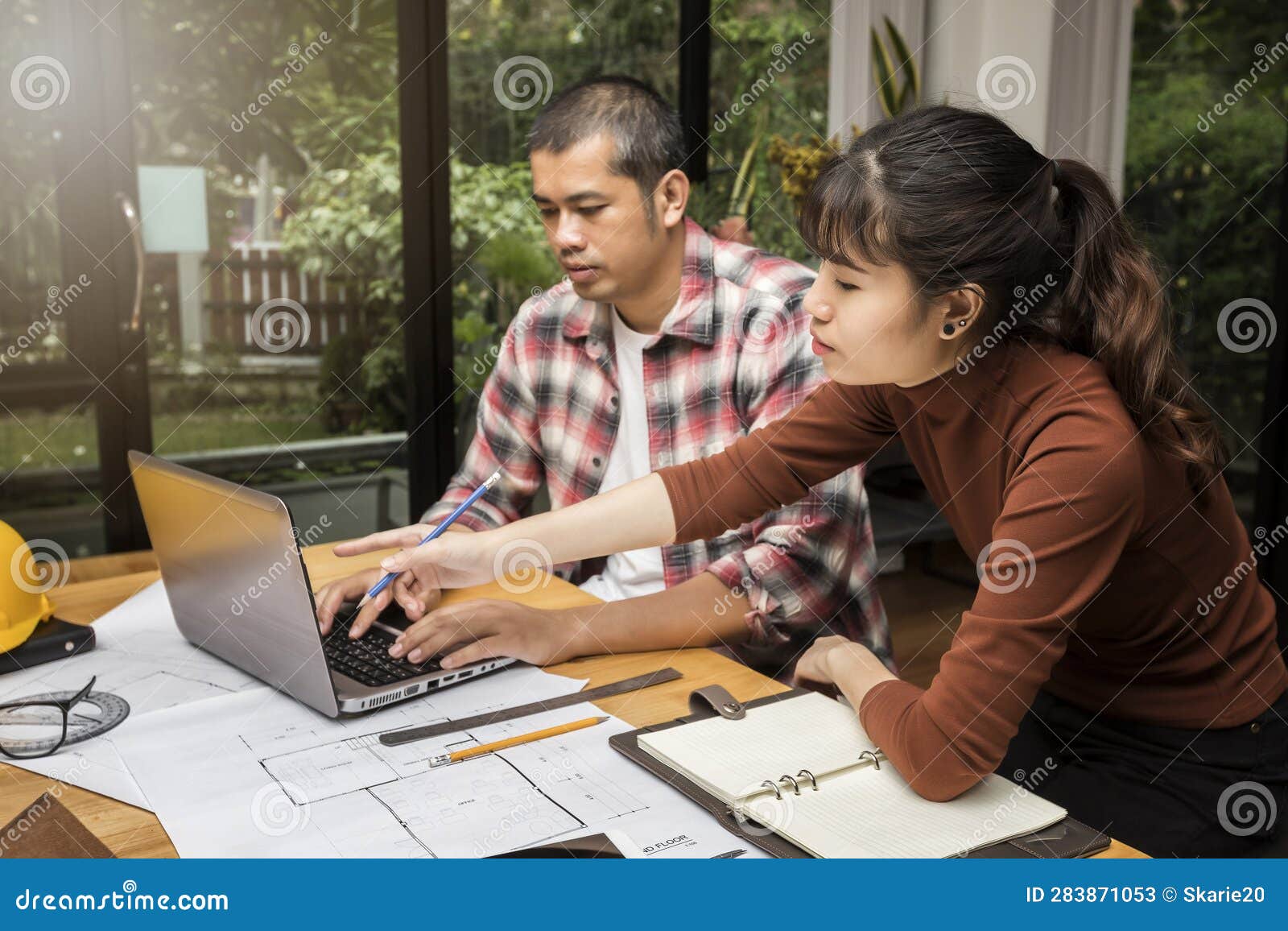 Group of Two Coworkers Working with Blueprint in Office. Co-working ...
