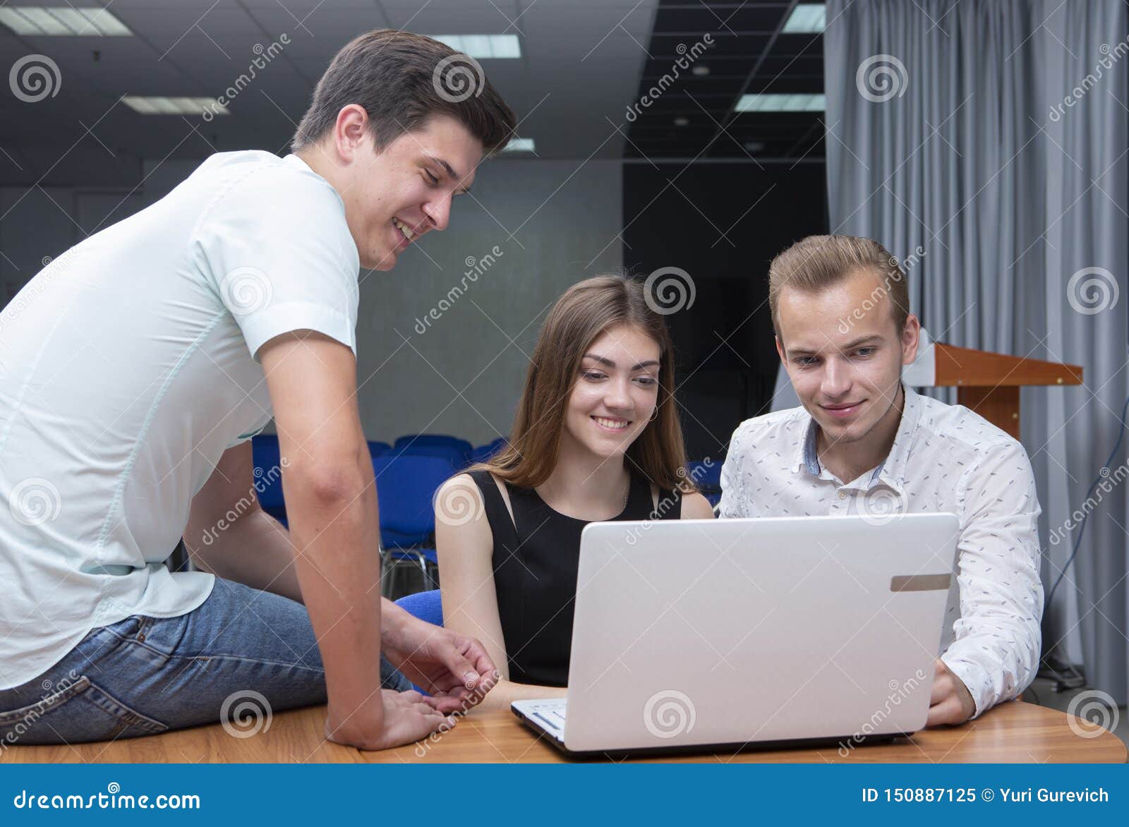 Group of Two Young Euphoric Students Watching Exam Results in a Laptop ...