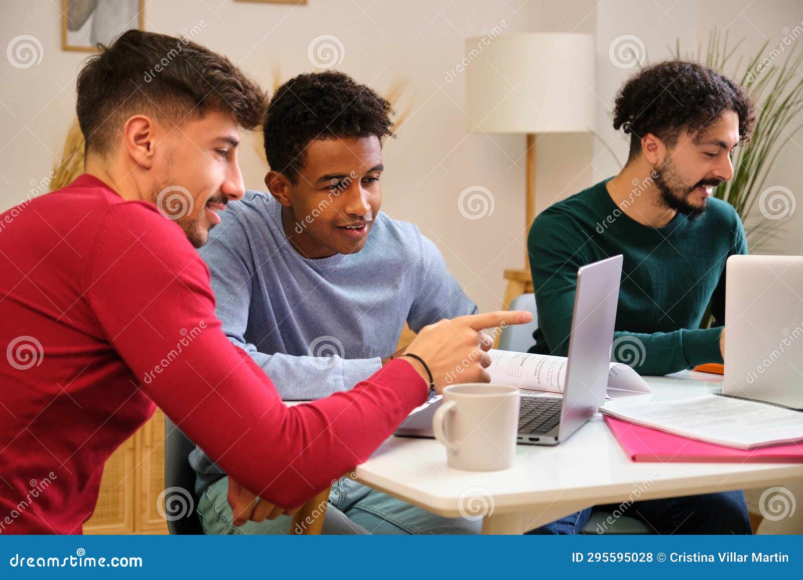 Group of University Colleagues Studying Together at Shared Students ...
