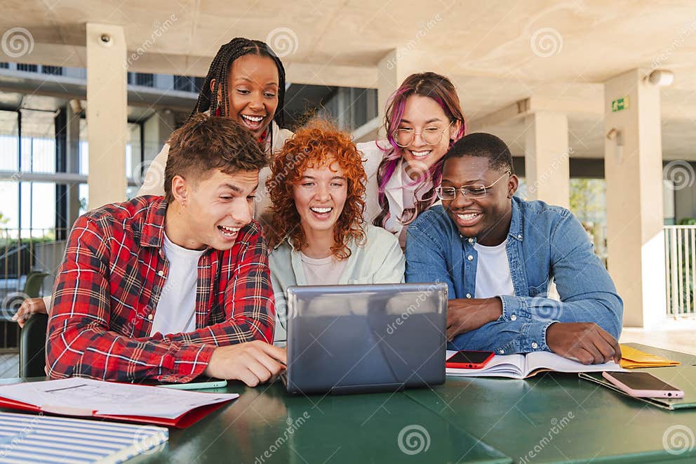 Group of University Students Collaborating on Homework Together in a ...