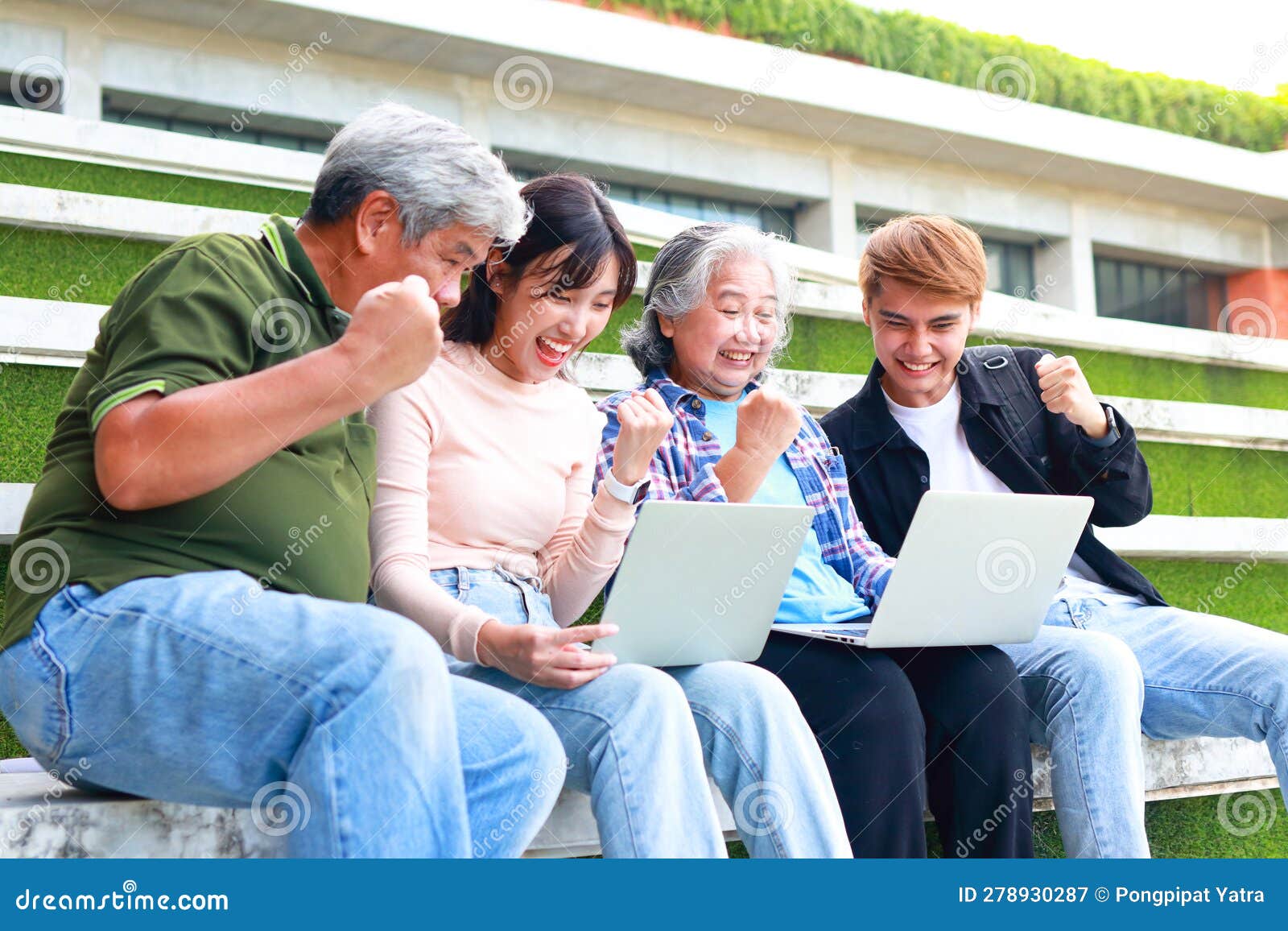 Group of University Students of Different Ages Smiling Happily Using ...
