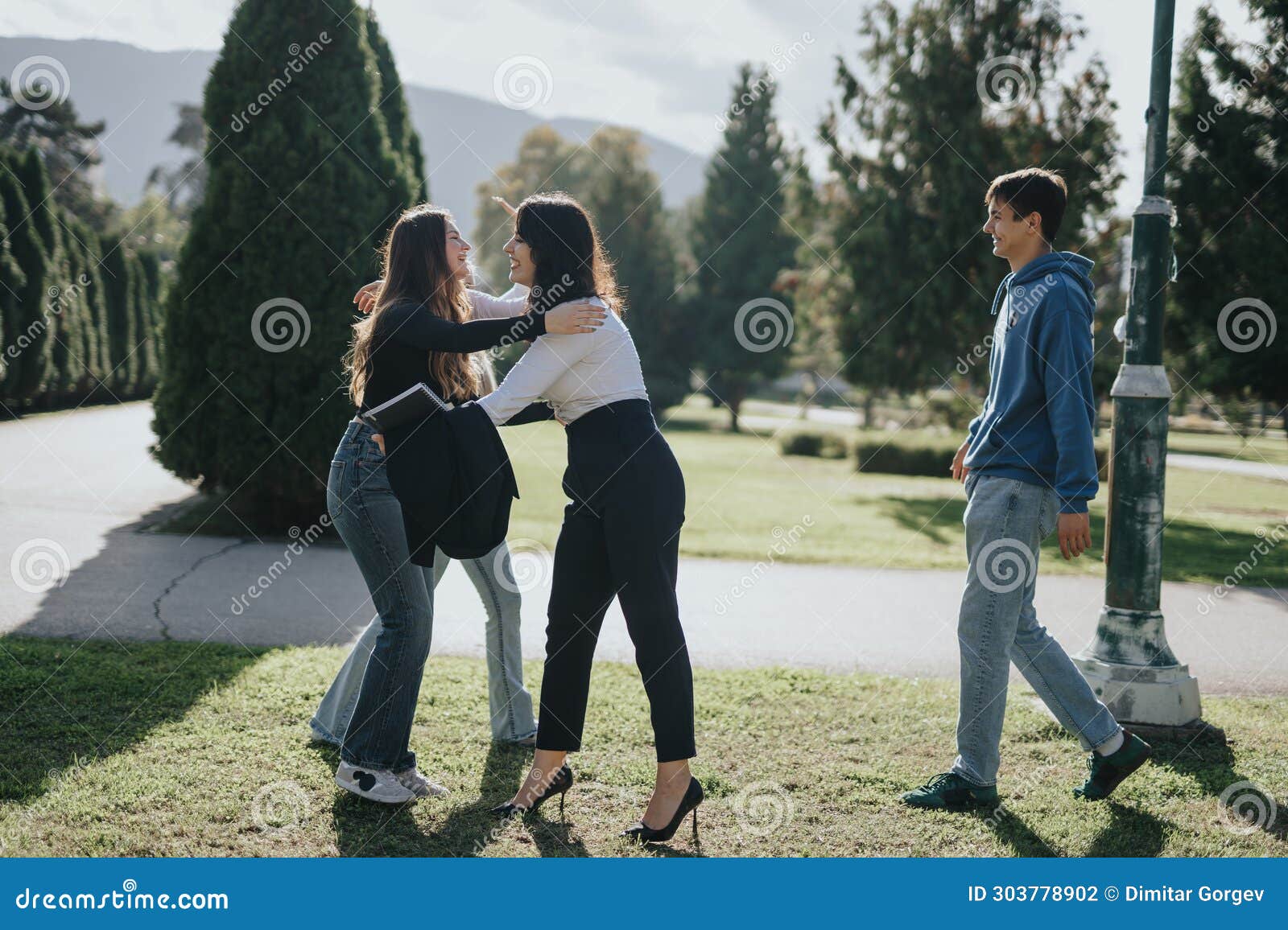 Group of University Students Discussing and Solving Tasks Outdoors in a ...
