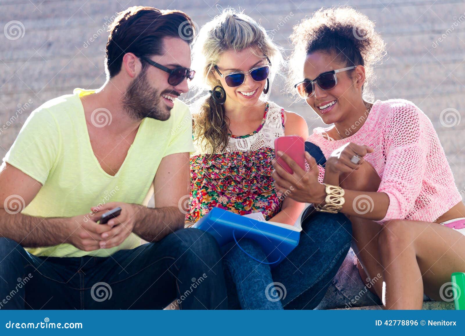Group of University Students Using Mobile Phone in the Street. Stock ...