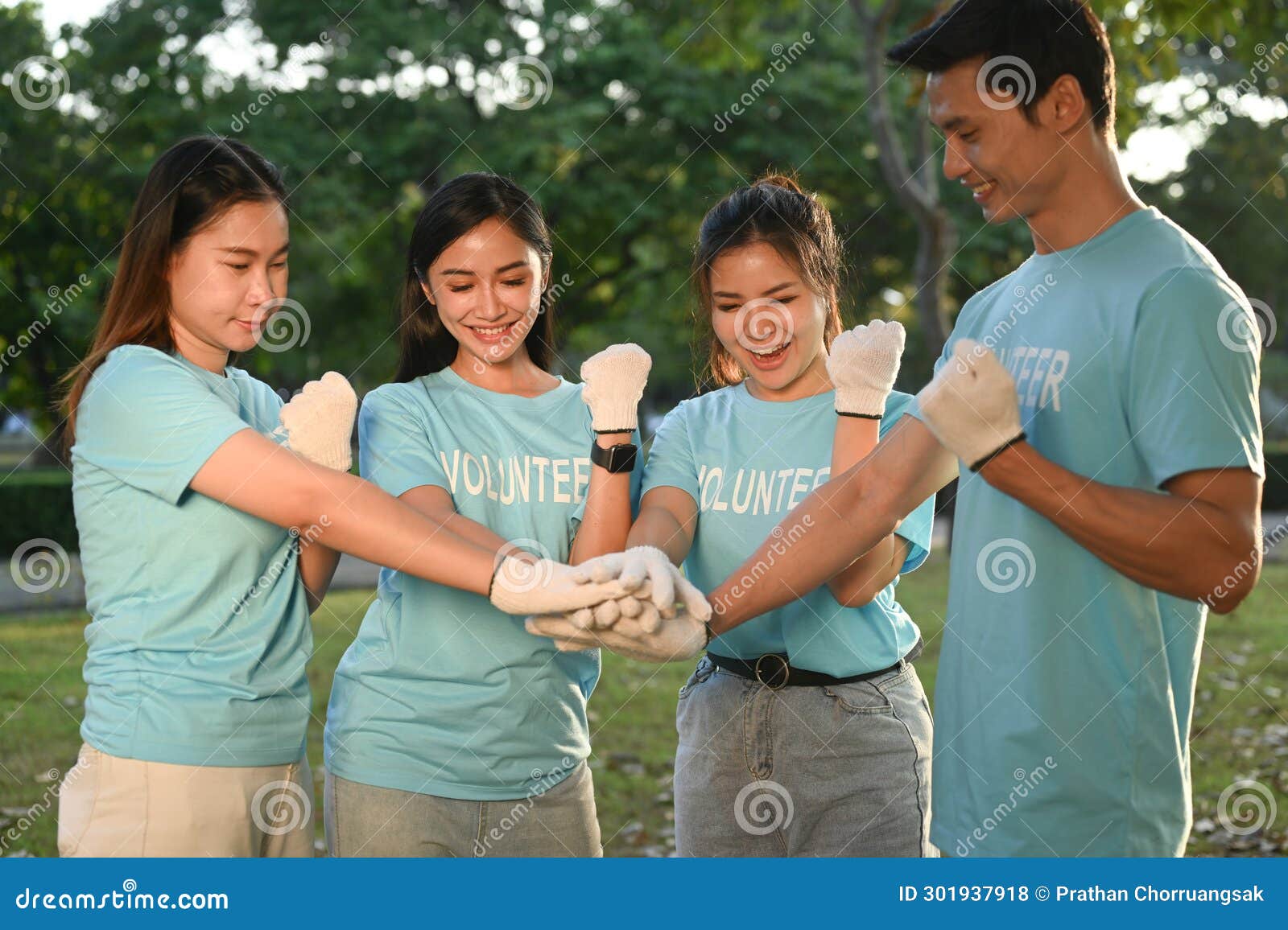 Group of Volunteers Stacking Their Hands Together Showing the Power of ...