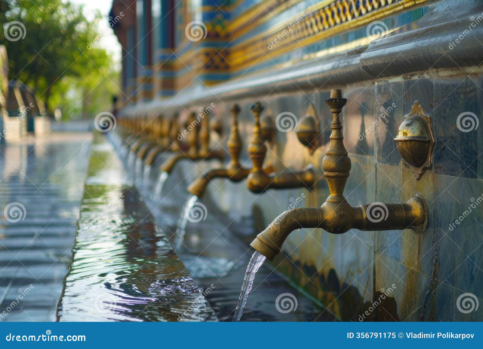 Group of Water Faucets Installed on the Exterior Wall of a Building ...