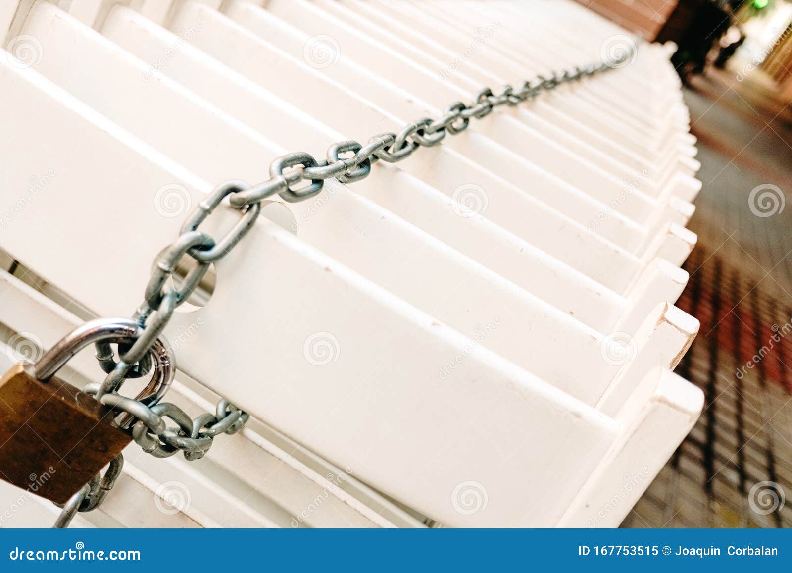 Group of White Chairs Tied with a Chain and Padlock Stock Image - Image ...
