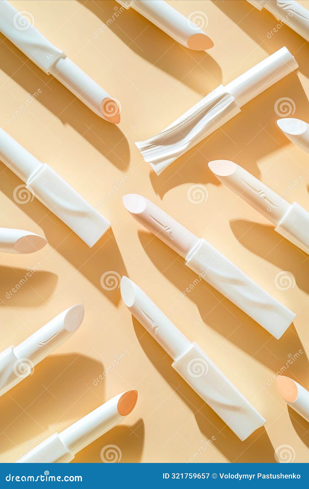 A Group of White Lipsticks on a Beige Surface Stock Image - Image of ...