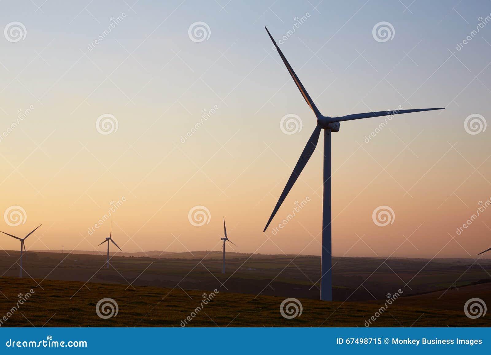 Group of Wind Turbines in Field at Dusk Stock Image - Image of people ...