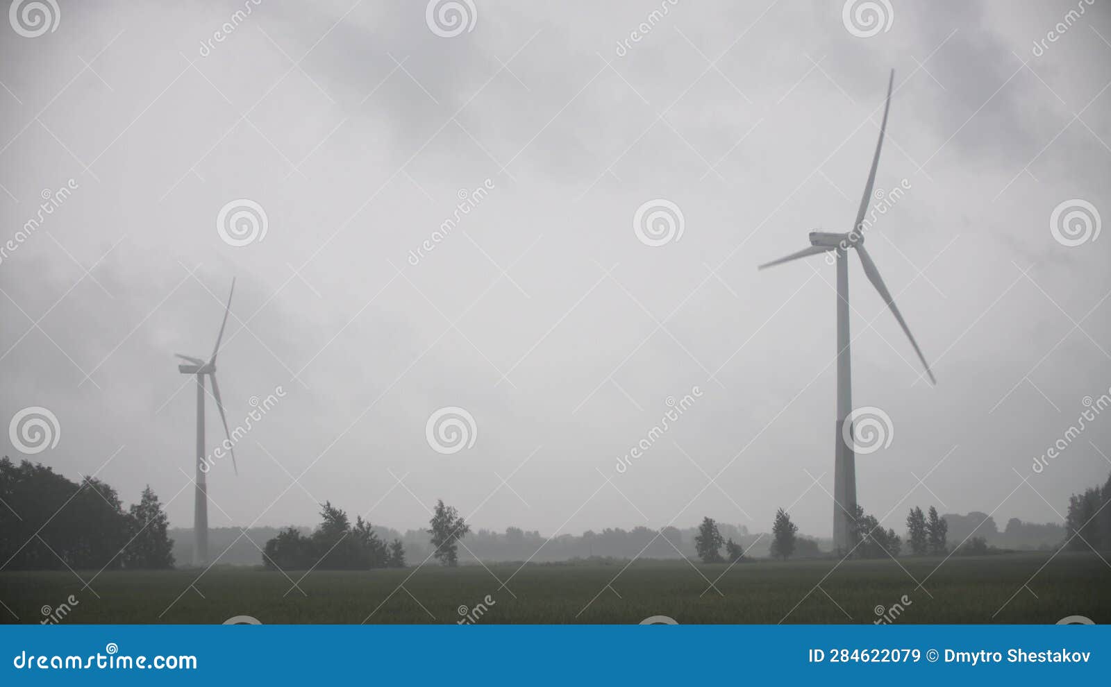 Group of Windmills for Electric Power Production in Heavy Rain Stock ...