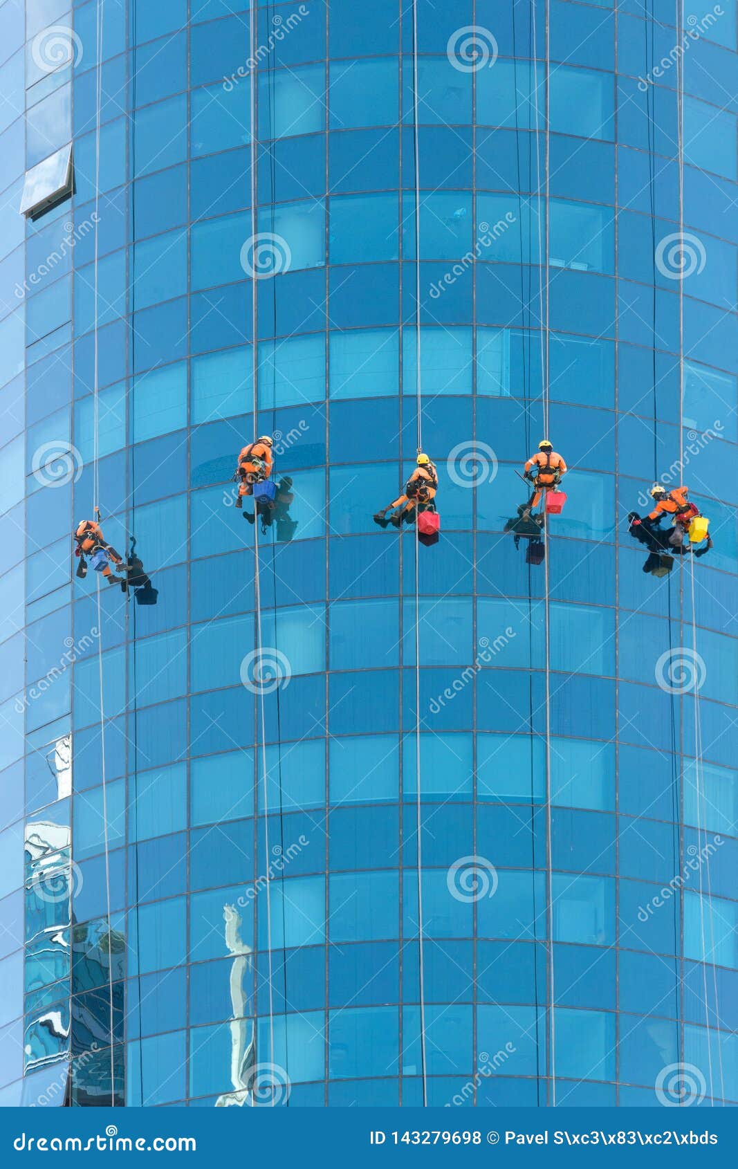 Group of Window Washers Hanging on Ropes on a Skyscraper Facade Stock ...