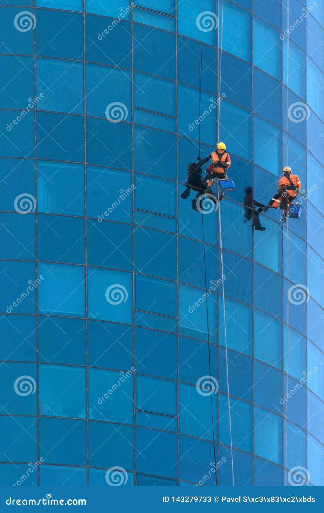 Group of Window Washers Hanging on Ropes on a Skyscraper Facade Stock ...