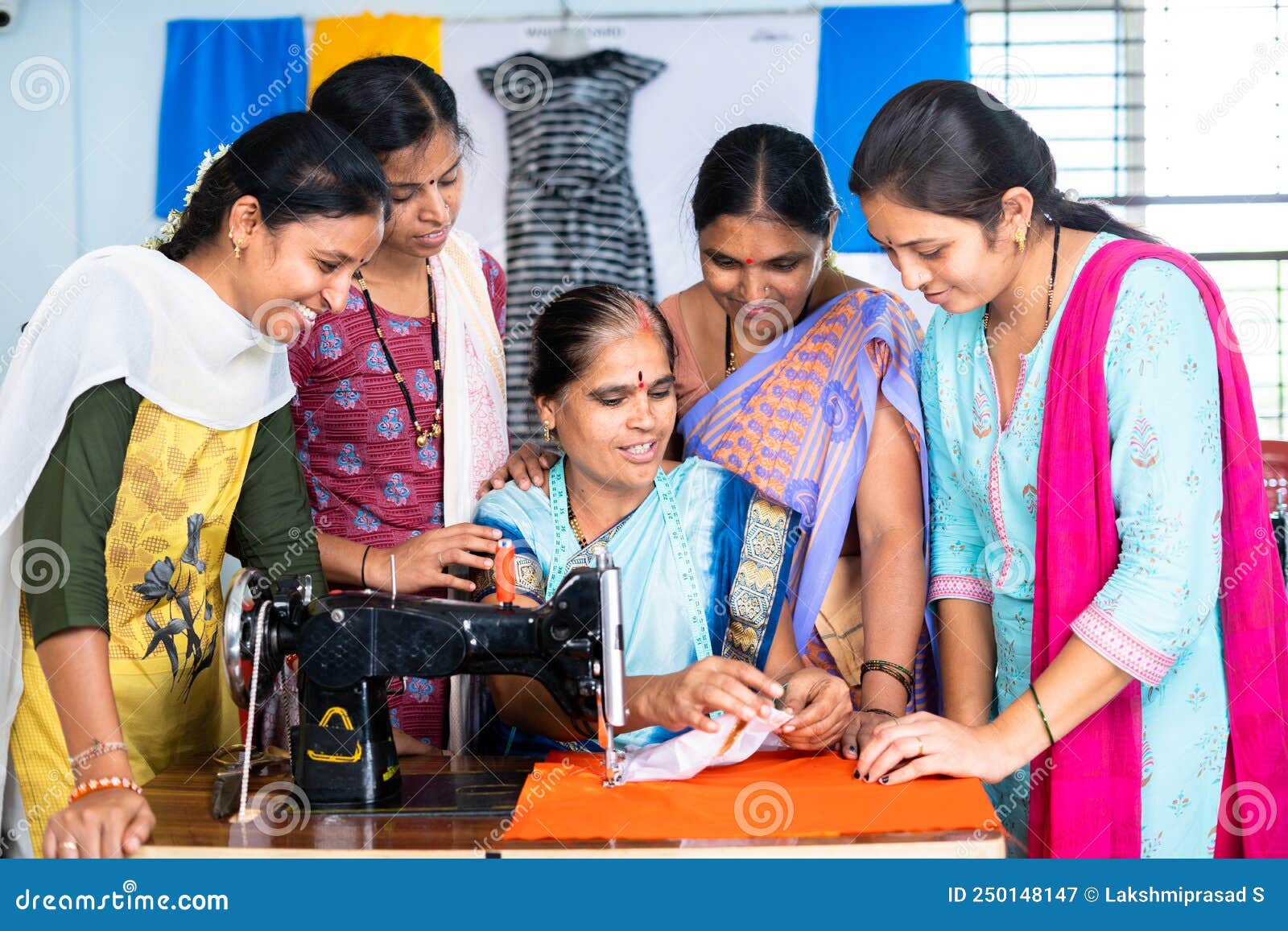 Group of Woman at Tailoring Class Discuissing with Teacher about Cloth ...