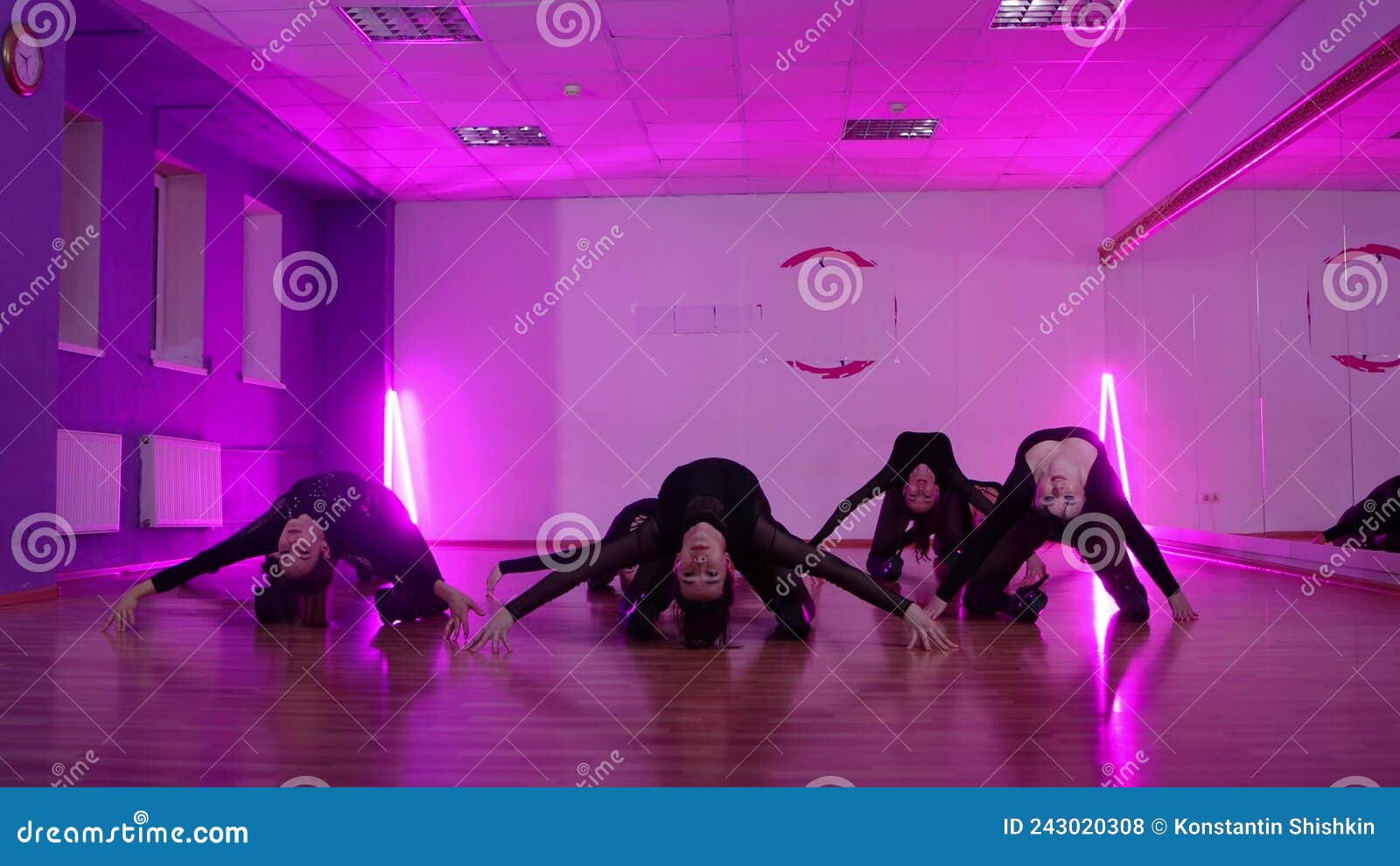 Group of Women in Black Clothes Training Synchronized Dance in the ...