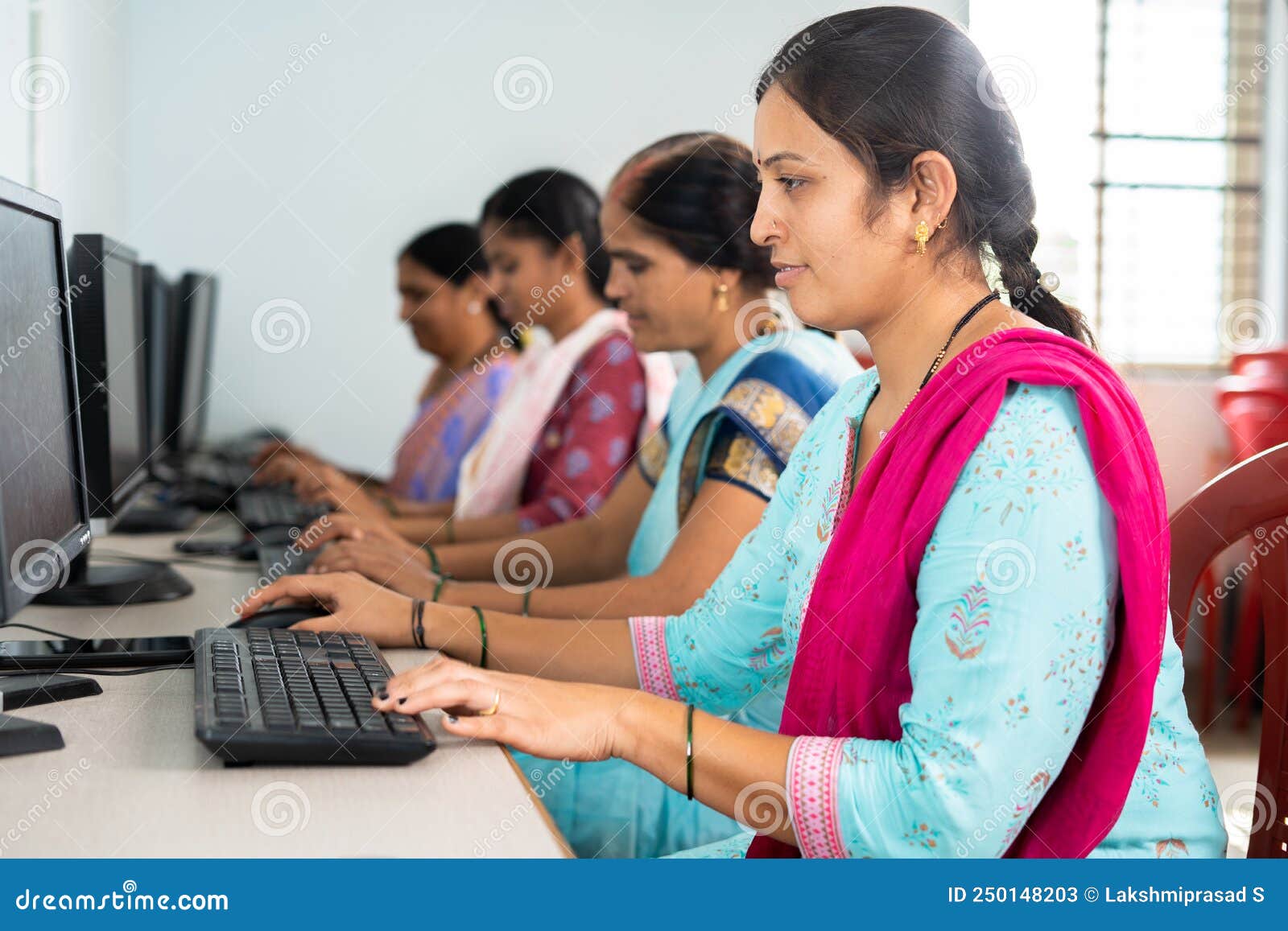 Group of Women Busy Learning or Working on Computer at Training Center ...