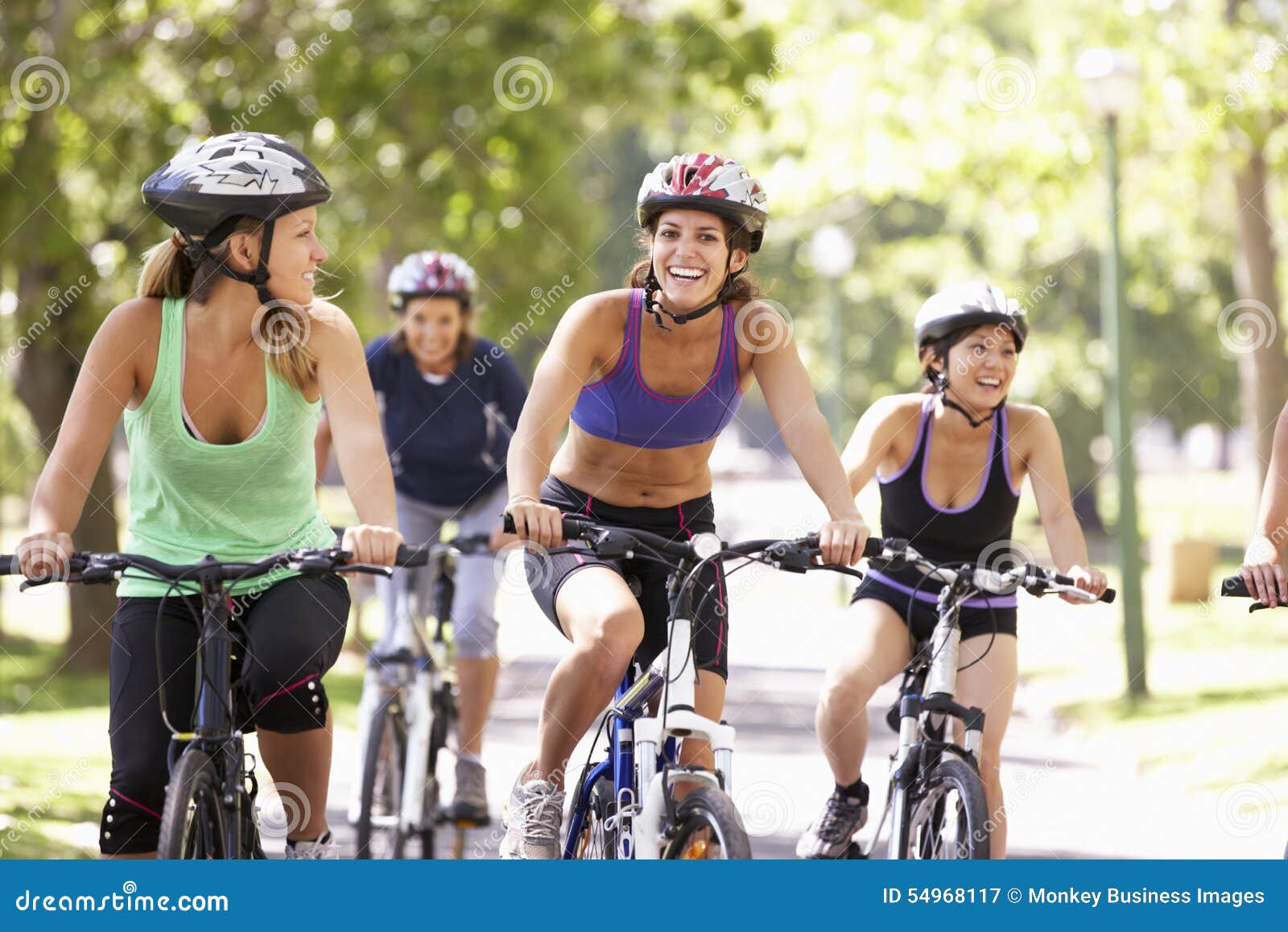 Group of Women on Cycle Ride through Park Stock Image - Image of bike ...