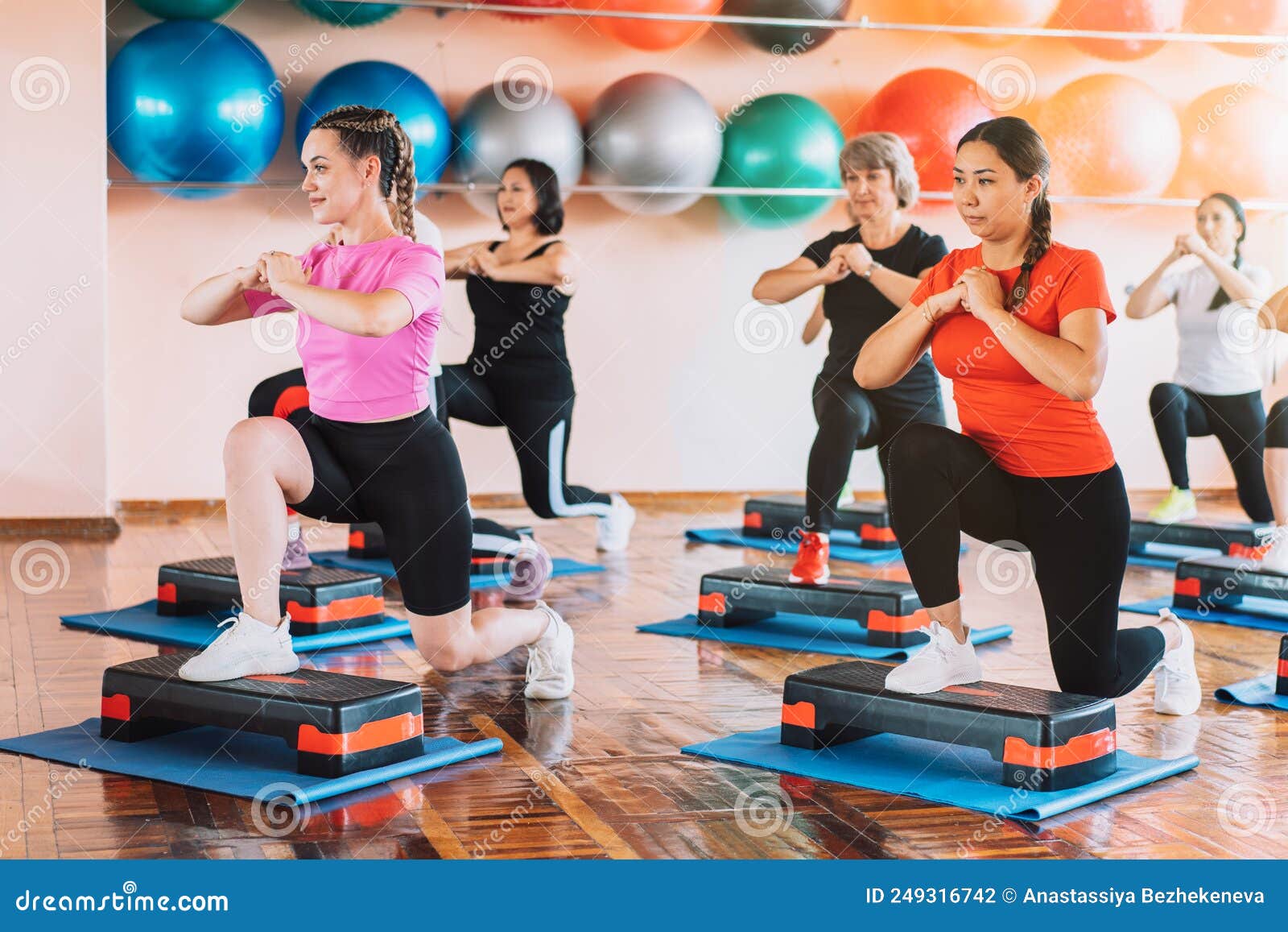 Group of Women Doing Step Aerobics Indoors Stock Photo - Image of ...