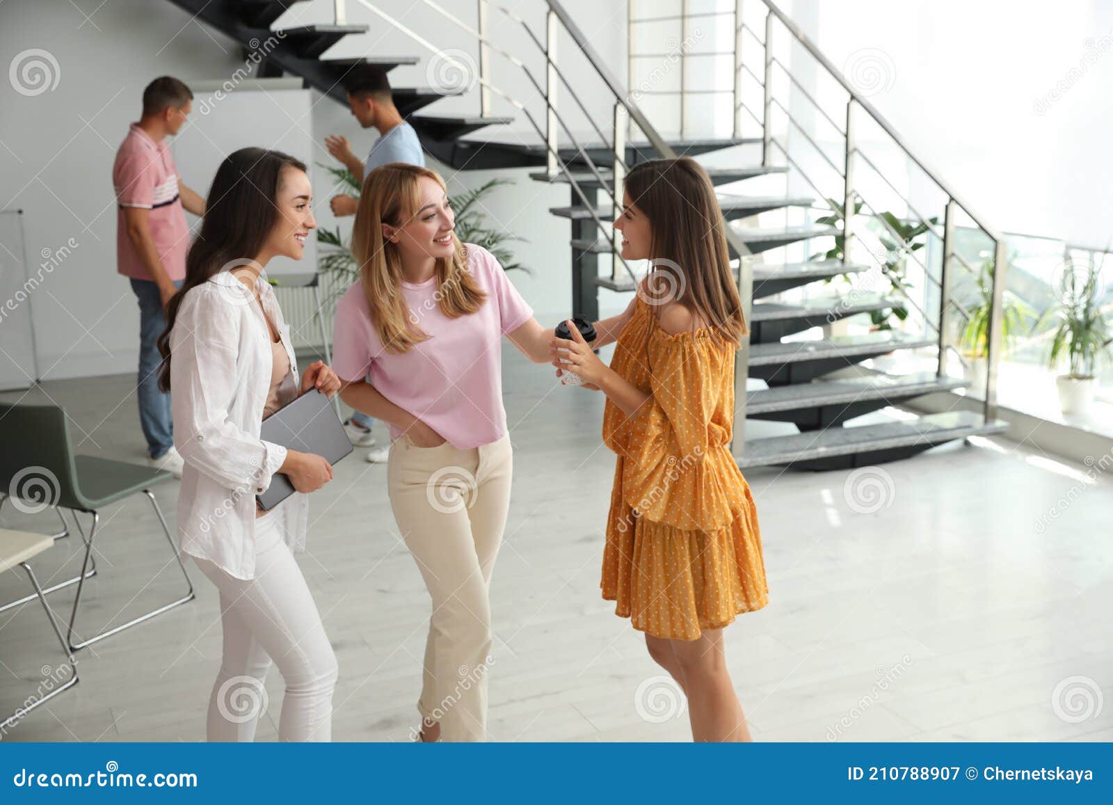 Group of Women Having Conversation in Hall Stock Image - Image of ...