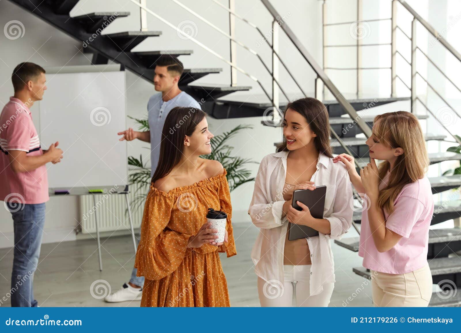 Group of Women Having Conversation in Hall Stock Photo - Image of group ...