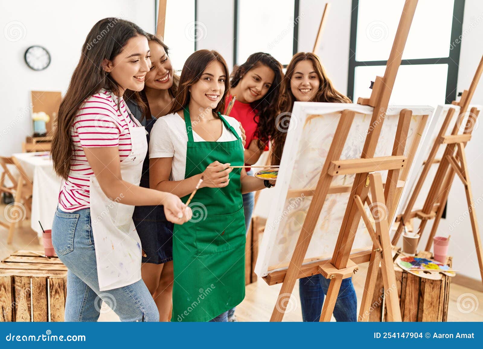 Group of Women Smiling Happy and Looking Draw of Partner Standing at ...